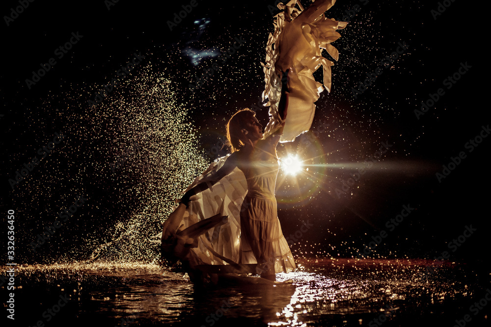 Beautiful white angel is dancing in the water drops. Stock Photo ...