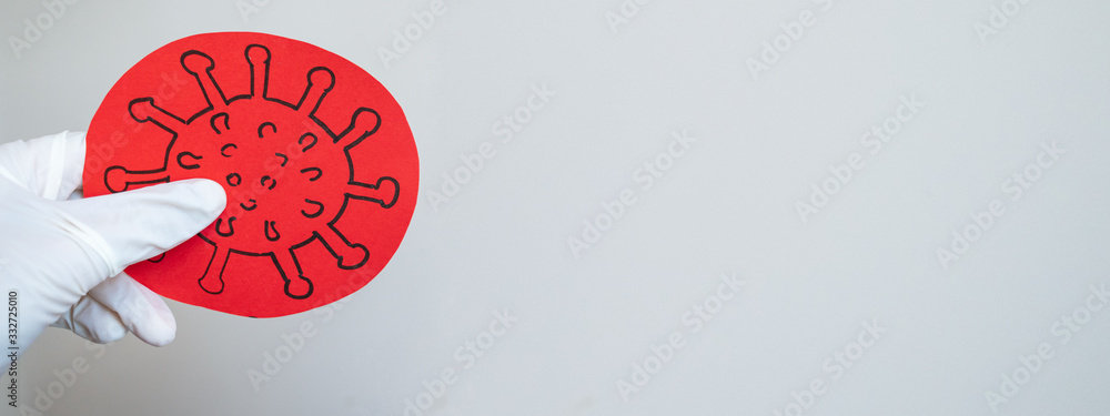 banner showing a hand with disposable gloves holding a red card with a ...