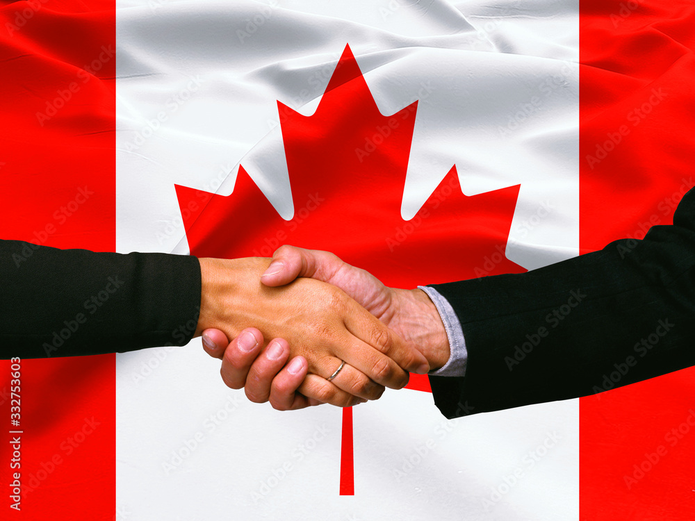 Business handshake on Canada flag background Stock Photo | Adobe Stock