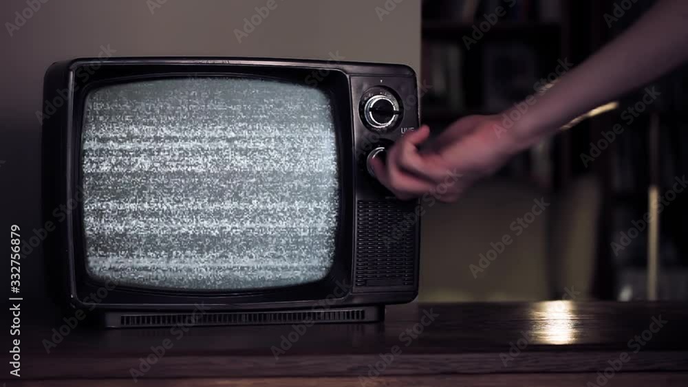 Male Hand hitting an Old Broken TV with Green Screen. You can replace ...