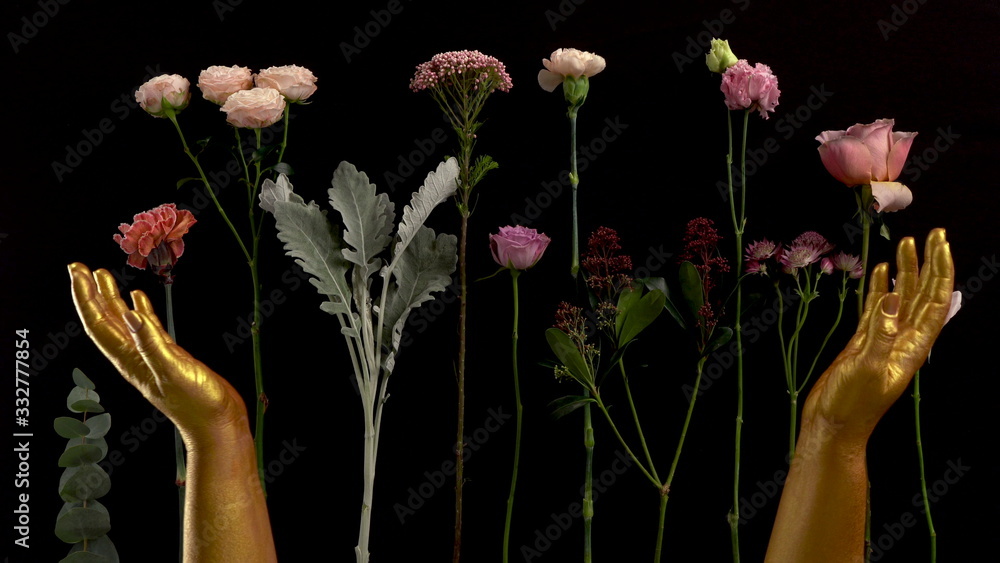 Gold hands clap on black background with flowers lay on the table. Nice ...