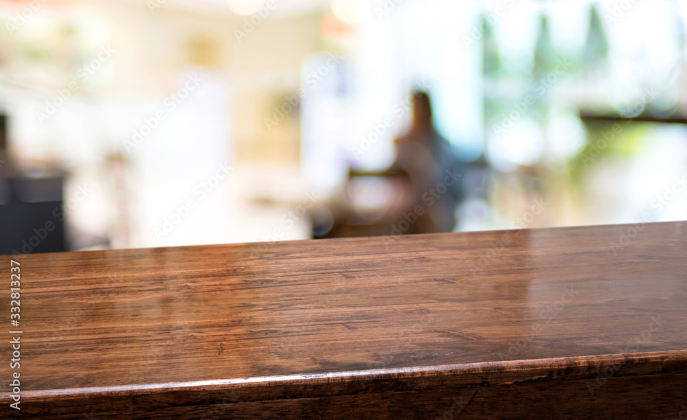 Wood diagonal table with people dinner at restaurant blur background ...