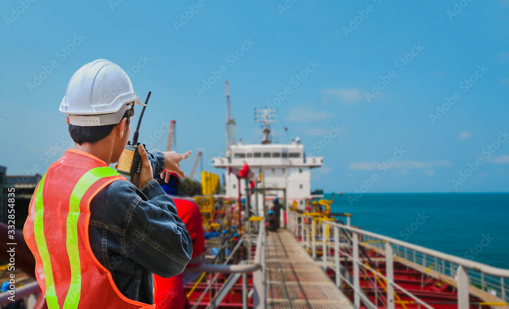crew worker on tanker ship, Male worker at construction site with hand ...