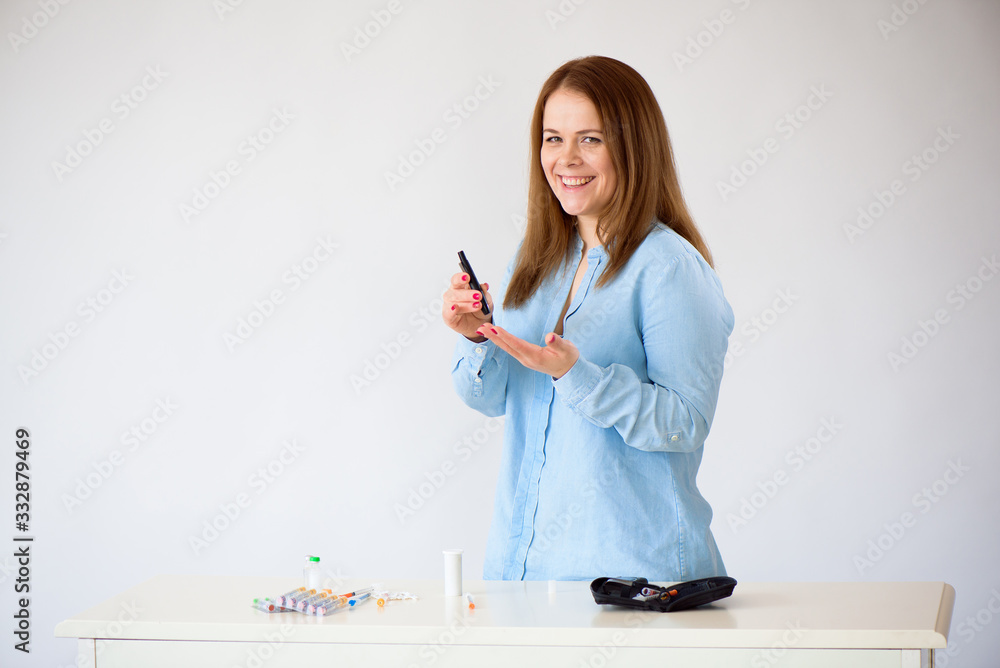 Diabetic patient measuring glucose level blood test using ultra mini ...