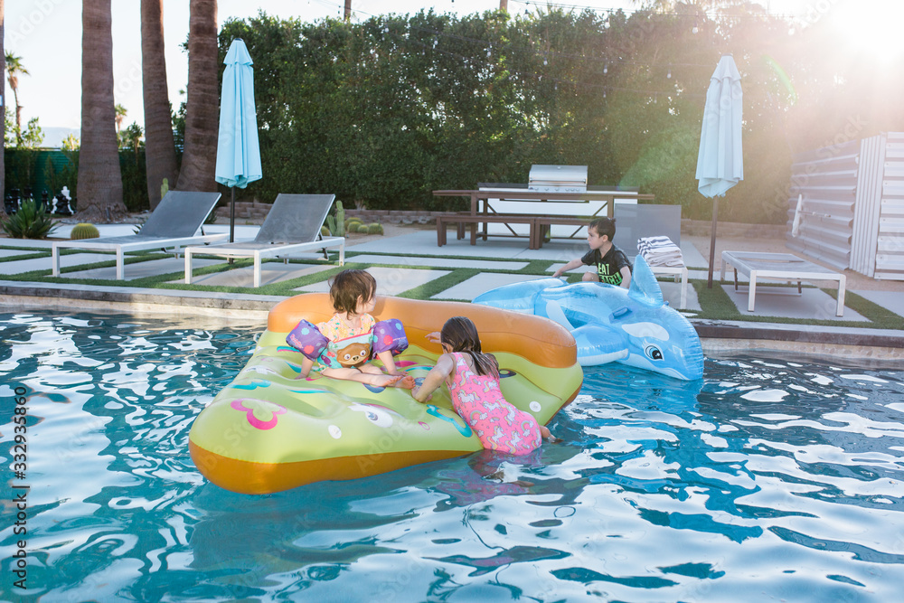 Kids Playing in Swimming Pool Stock Photo | Adobe Stock