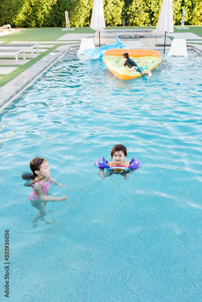 Kids Playing in Swimming Pool Stock Photo | Adobe Stock