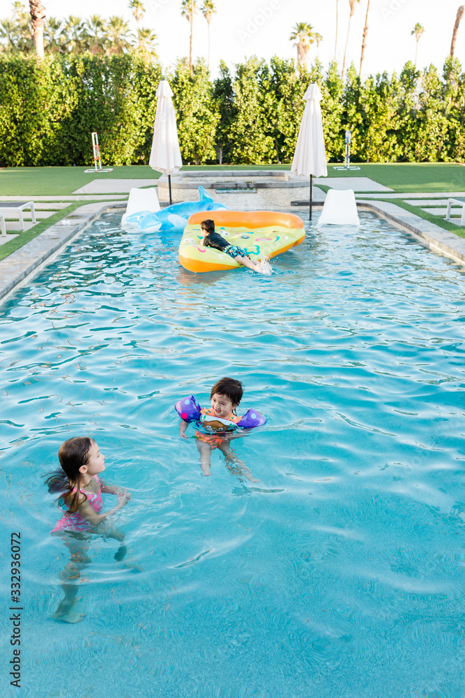 Kids Playing in Swimming Pool Stock Photo | Adobe Stock
