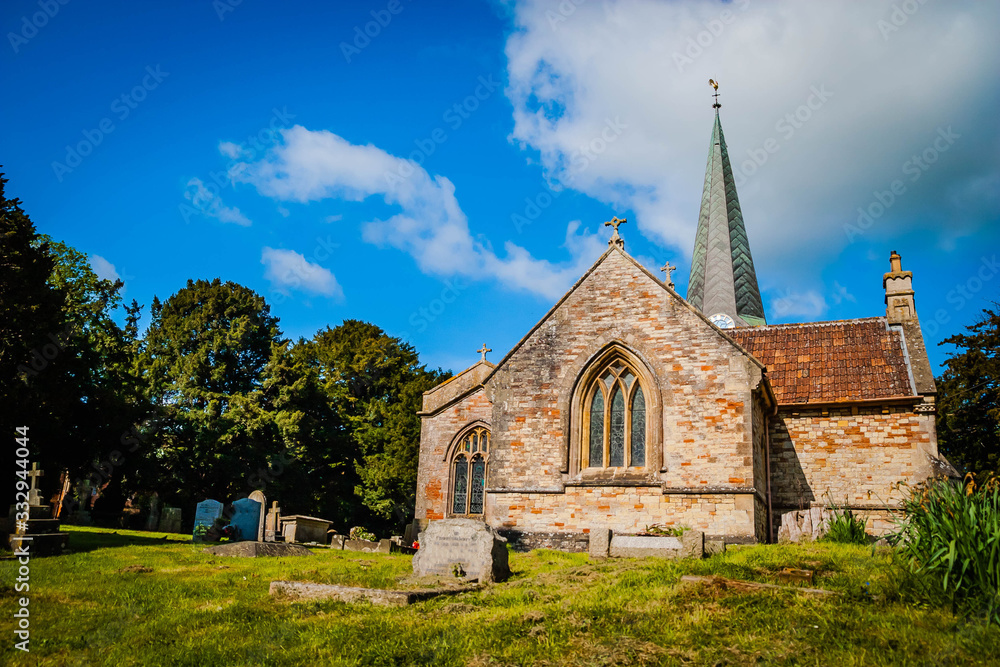 Old English church with graveyard Stock Photo | Adobe Stock