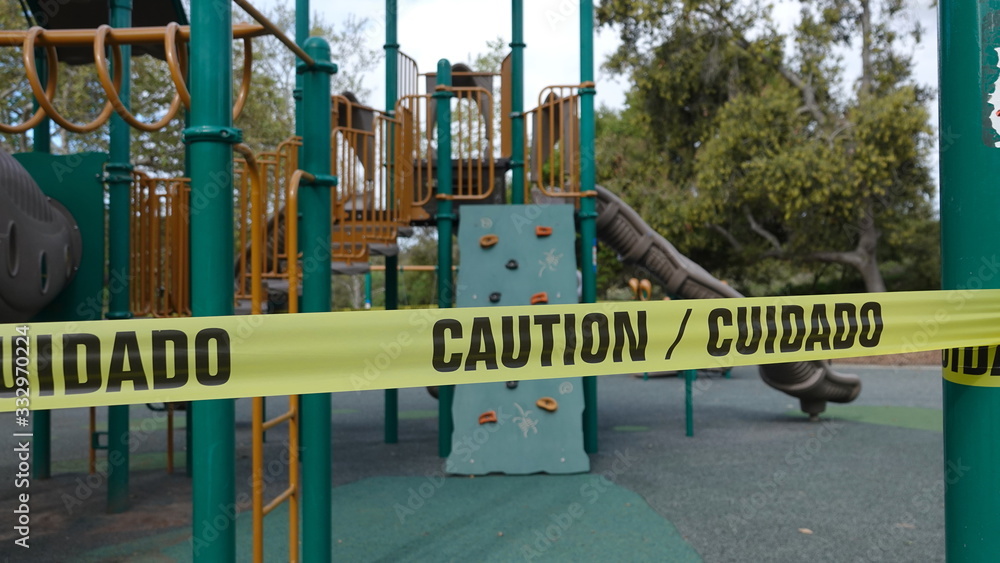 Bi-lingual caution tape ropes of a California playground closed down ...