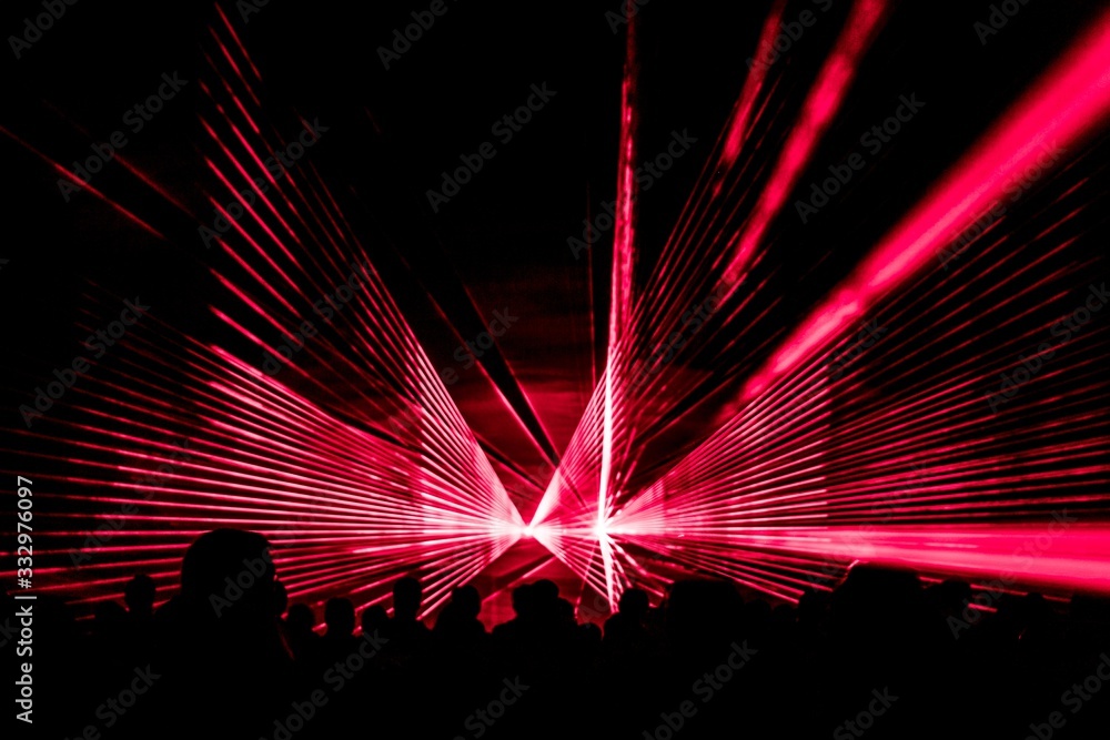 Red laser show nightlife club stage with party people crowd. Luxury ...