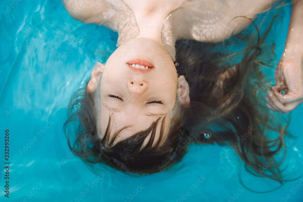 Portrait of a little girl in the water with closed eyes Stock Photo ...