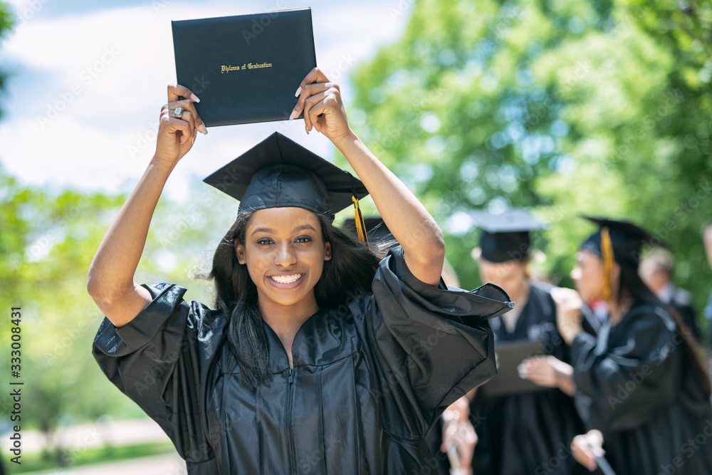 Grad: Pretty Graduate Holds Up Diploma Stock Photo | Adobe Stock