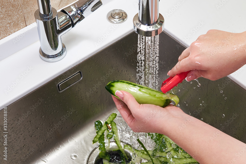 Food waste disposer machine in sink in modern kitchen Stock Photo ...