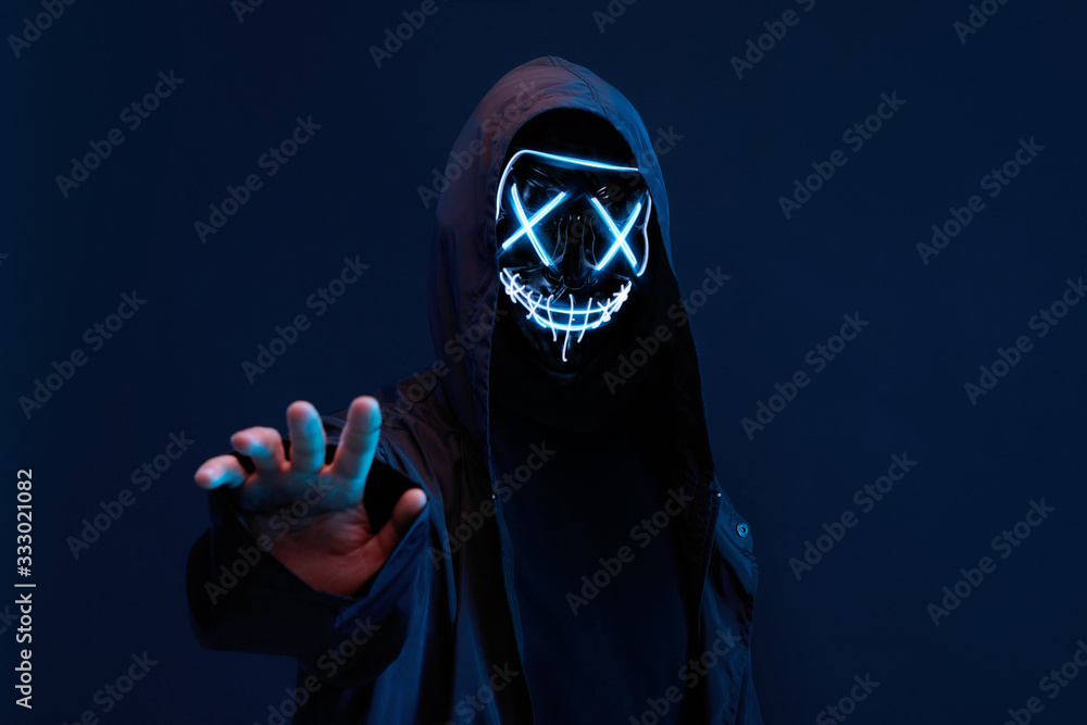 Dangerous hooded hacker. Internet, cyber crime, cyber attack, system breaking and malware ...