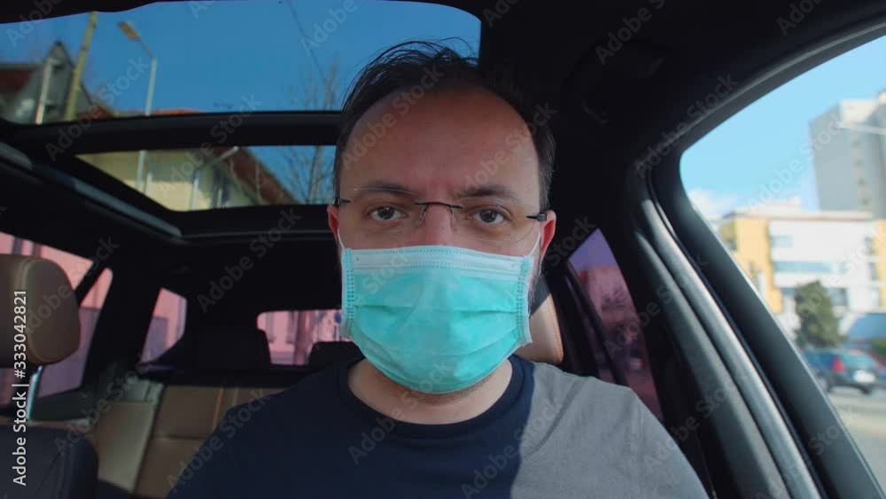 Portrait Of A Man Putting On His Medical Mask. Man Prevent Coronavirus ...