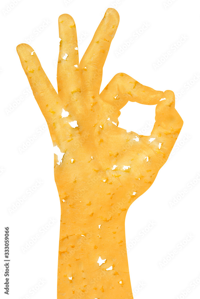 On the hand cut out of cheese on a white isolated background is ...
