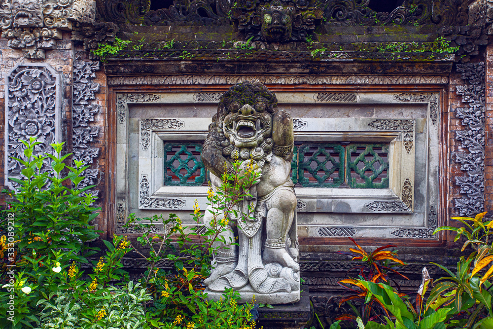 Traditional stone statues depicting demons, gods and Balinese ...