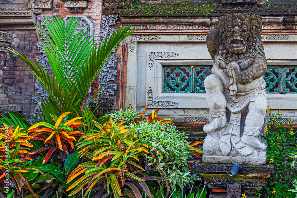 Traditional stone statues depicting demons, gods and Balinese ...
