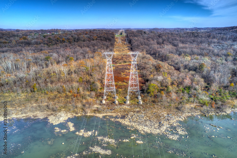 Aerial View of High Tension Power Lines Cutting Through Woods with Fall ...