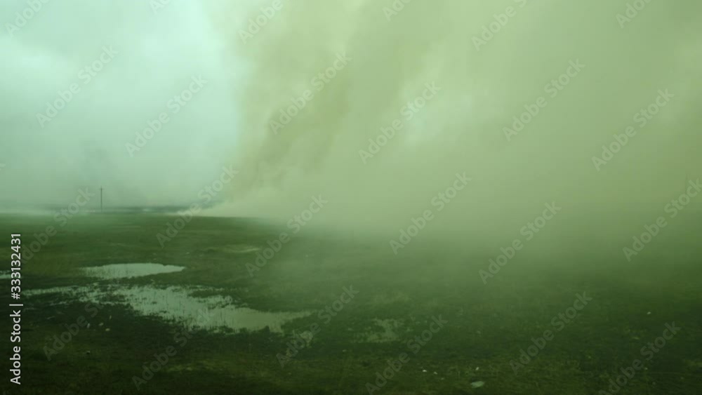 Poisonous atmosphere, green suffocating smoke from peat fire ...