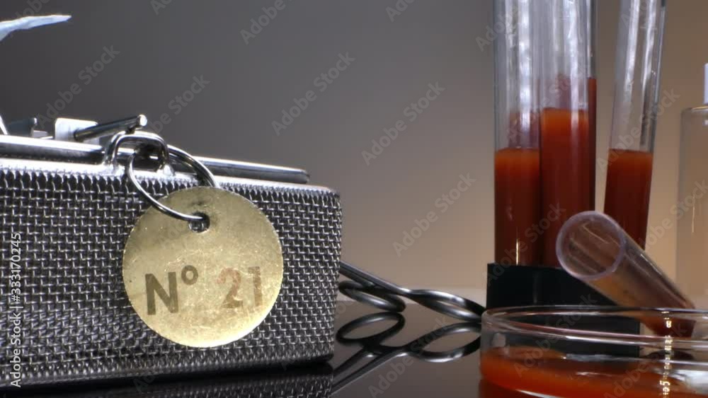 concept medical clamps, metal box with tools and test tubes with blood ...