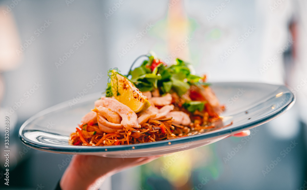 Hands Holding Plate Of Food