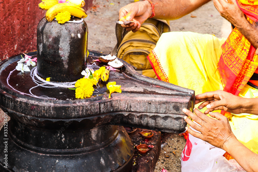 Black Stone Shivaling Of Lord God Shiva And Hands Of Hindu Holy Devotee ...
