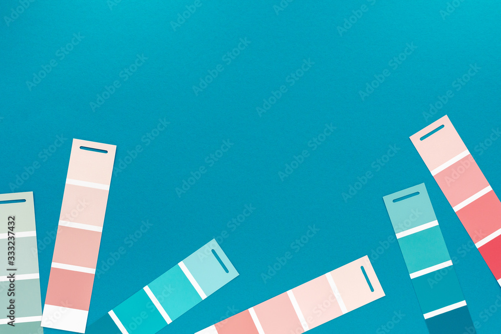 Selection of palette for painting, sample color catalog on a turquoise ...