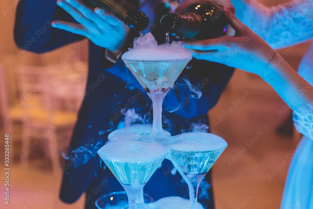 Glasses with alcoholic beverages in the pyramid, beautiful pyramid line ...