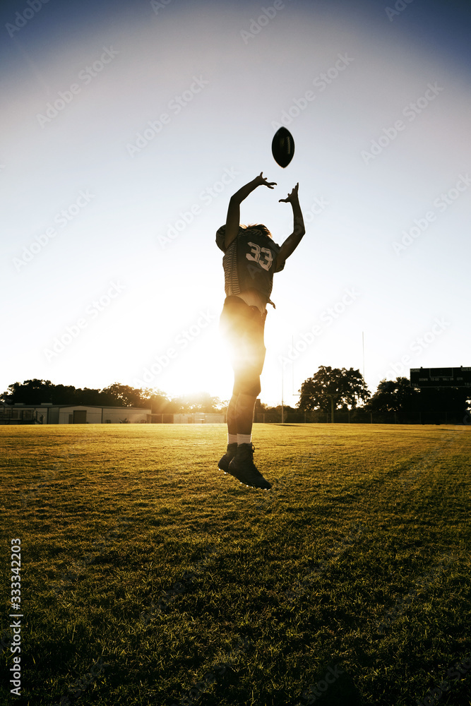 Football Player Jumping Catch