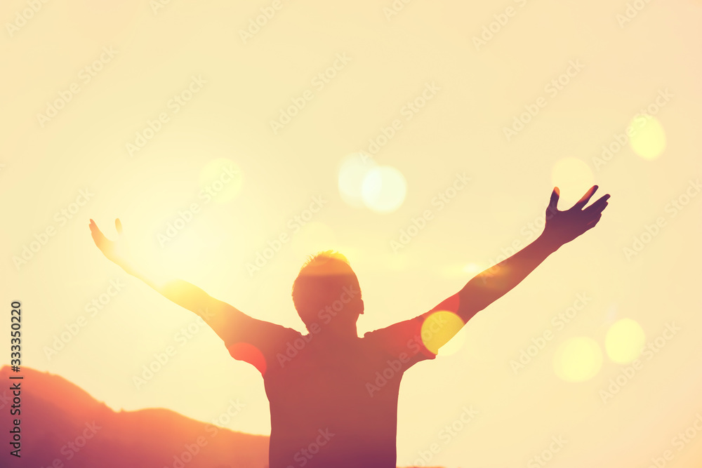 Copy space of man rise hand up on top of mountain and sunset sky ...