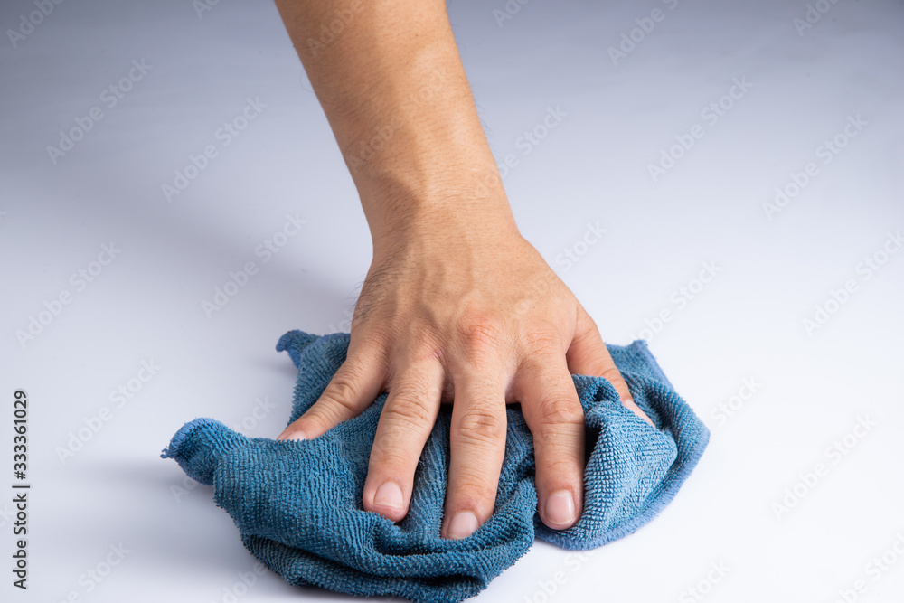 washing white acrylic sheet by bare hand and blue rag sponge foam on ...