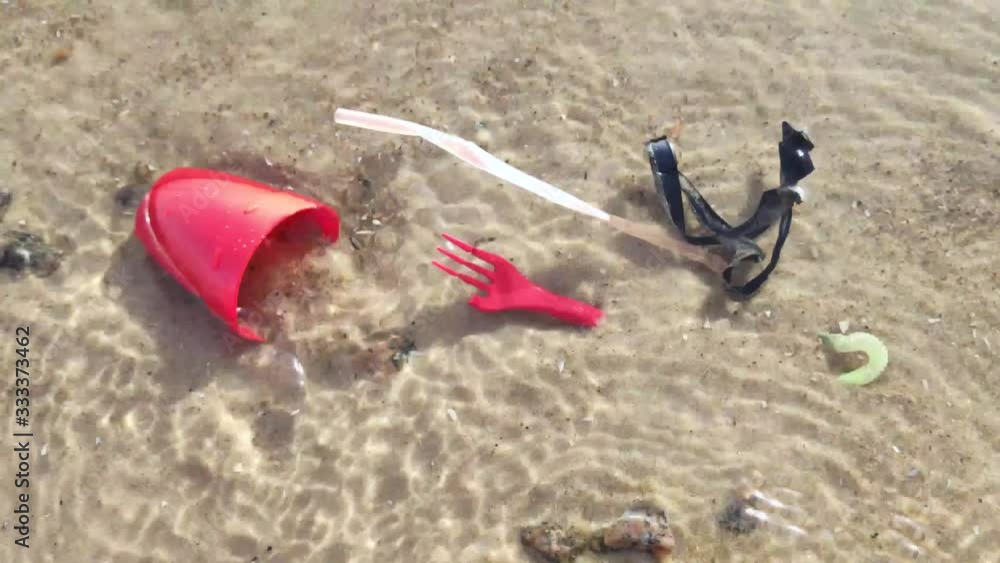 Plastic trash floats in the water. Ocean pollution with toxic waste ...