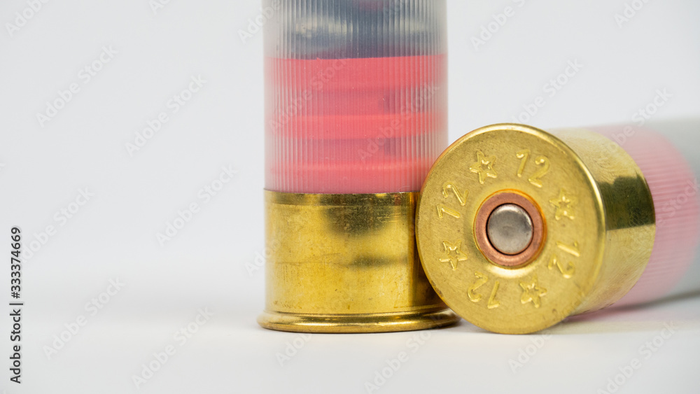 12 gauge shotgun ammunition on a white background Stock Photo | Adobe Stock