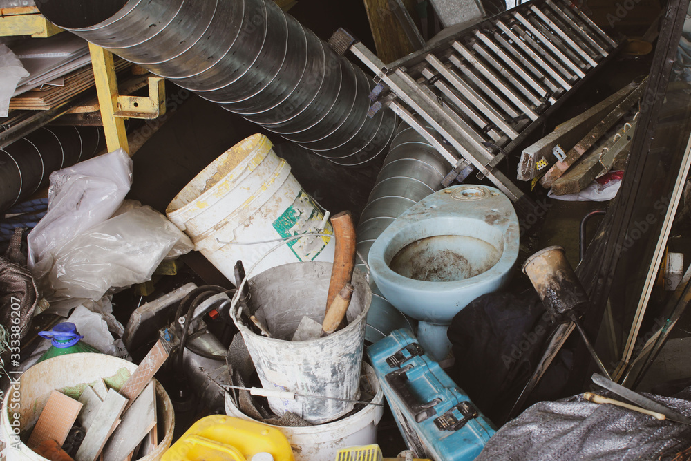 Big mess in an over stuffed suburban garage. Stock Photo | Adobe Stock