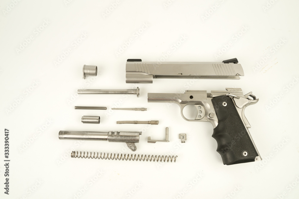 Parts of a .45 ACP hand gun, Model 1911. 11 mm gun. Stock Photo | Adobe ...