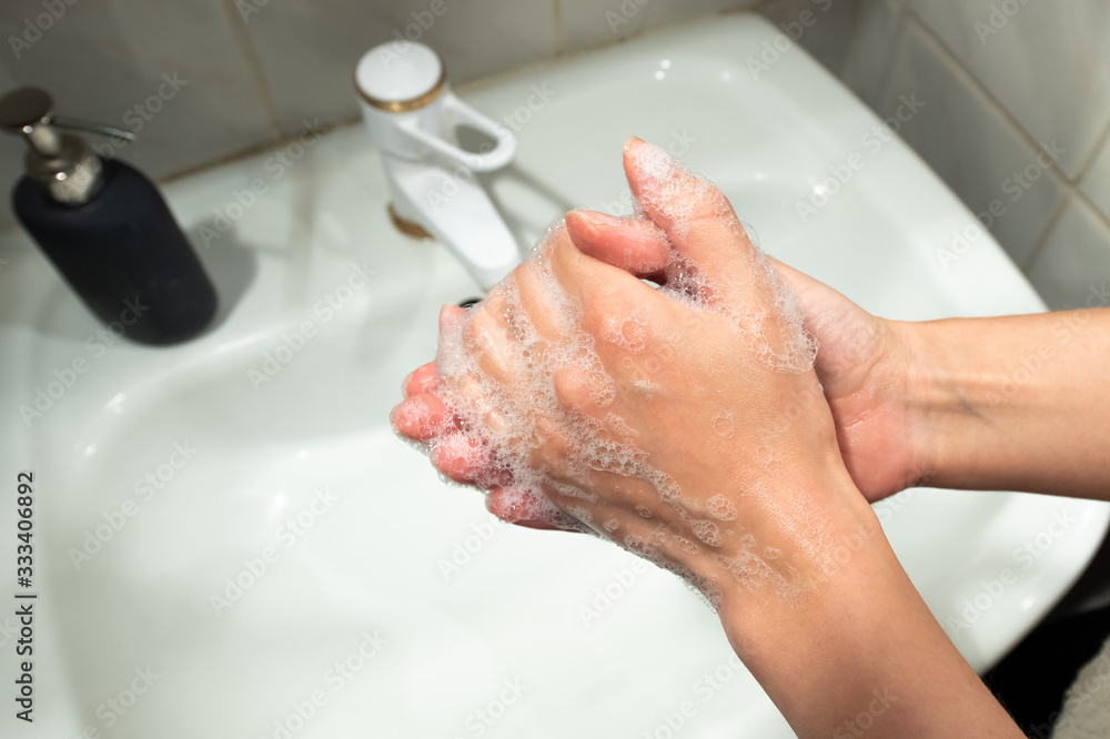 How to prevent coronavirus from spreading. Washing hands with soap and ...