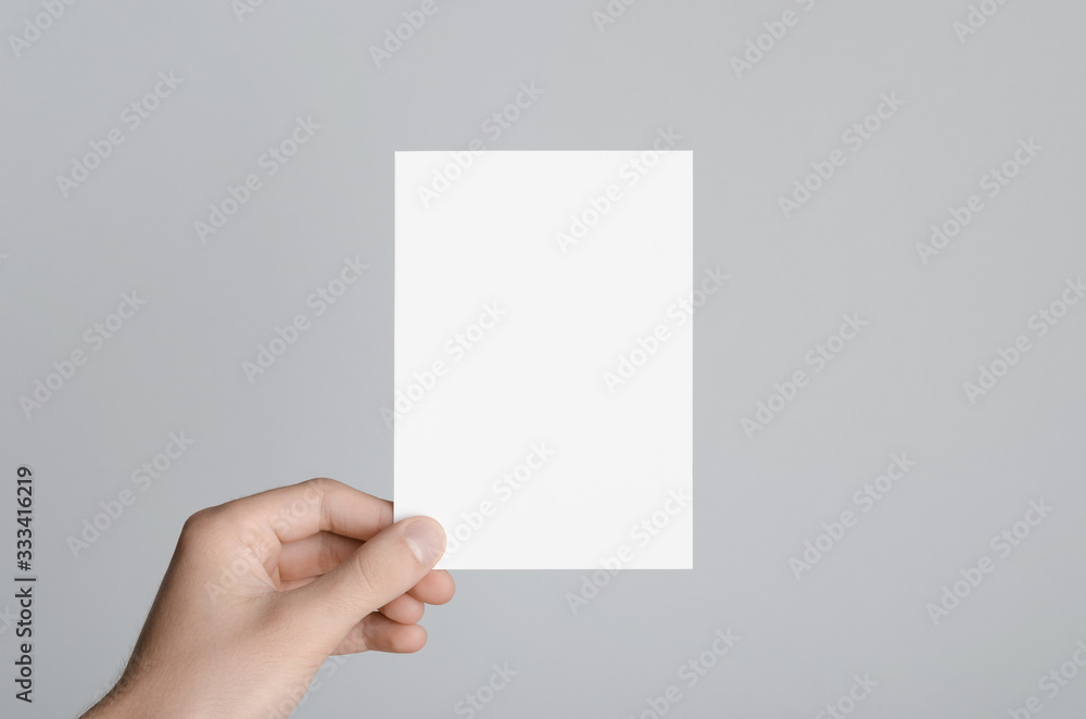 A6 Flyer / Postcard / Invitation Mock-Up - Male hands holding a blank ...
