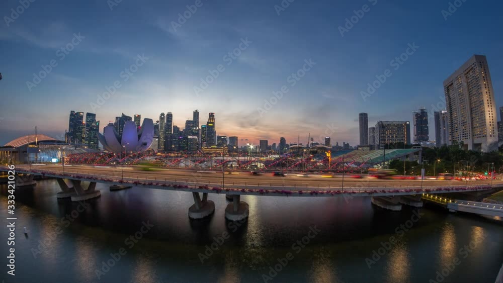 Aerial view over Helix Bridge and Bayfront Avenue with traffic day to ...