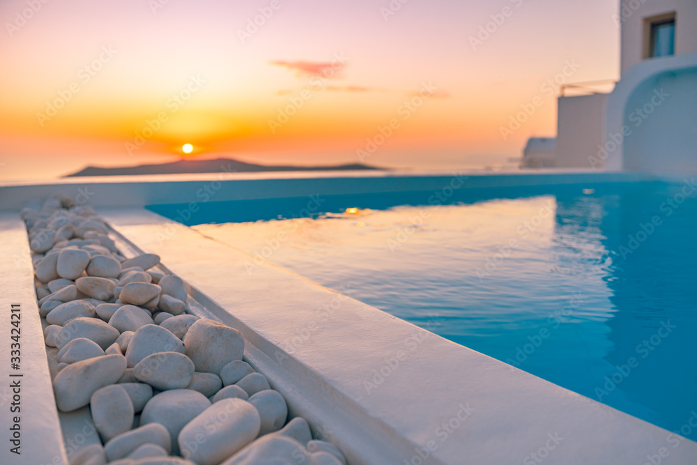 Amazing sunset relaxing mood the pool in a luxurious hotel resort at ...