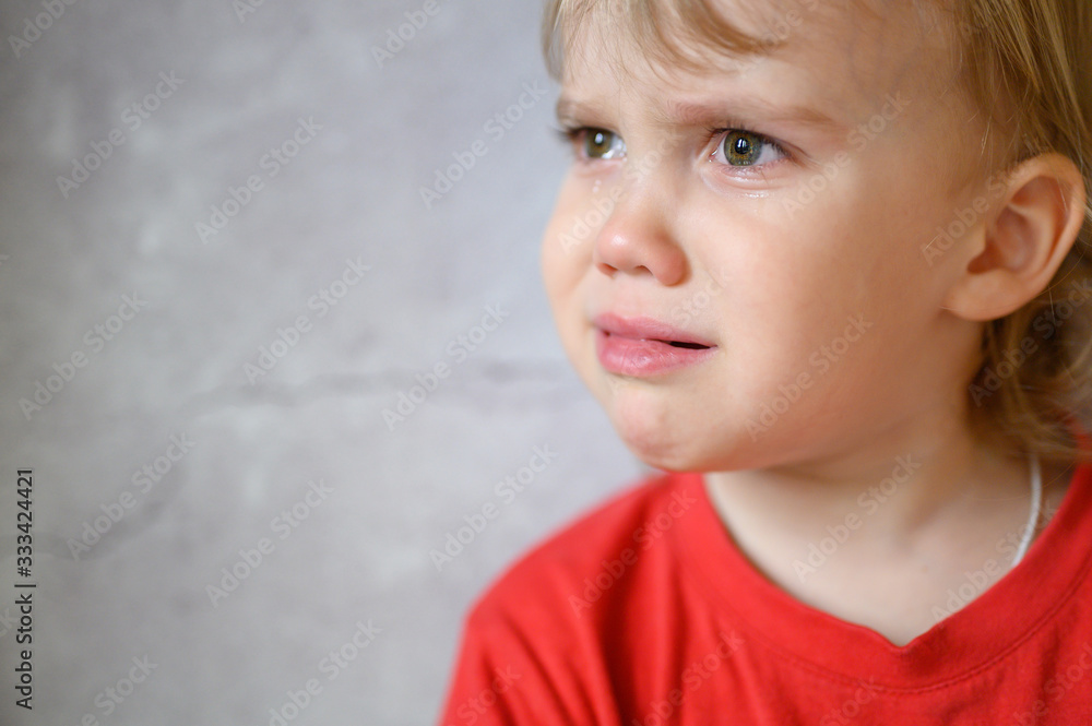 kid crying. the face of a cute little upset four year old baby boy in ...