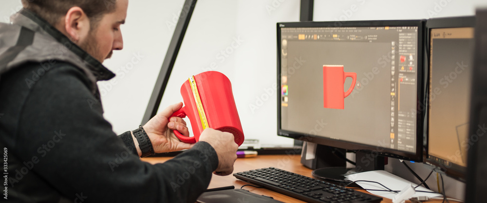 Graphic designer and 3d animator work at computer in office foto de ...