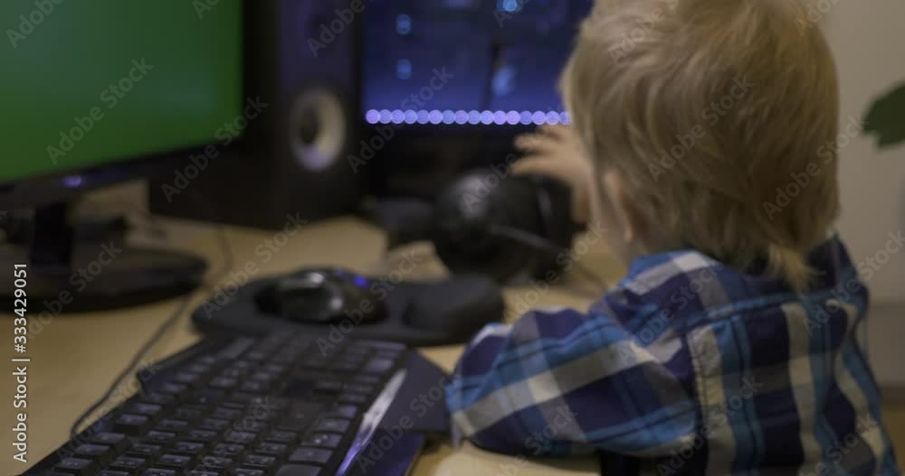 Little Child Puts on Head Studio Headphones in Front of Green Screen ...