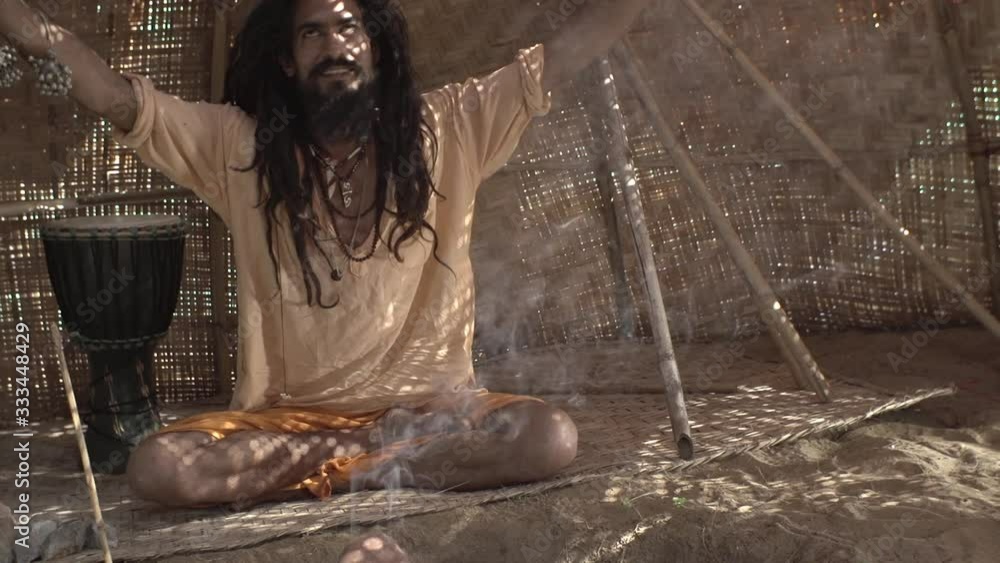 Shamanic session in the bungalow. Shaman during prayer during prayer ...