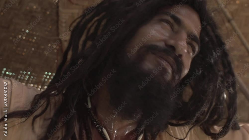 Shamanic session in the bungalow. Shaman during prayer during prayer ...