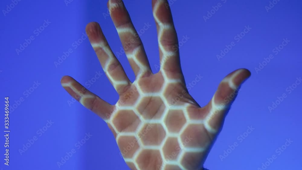 Palm of a hand getting scanned by a biometric laser technology for ...