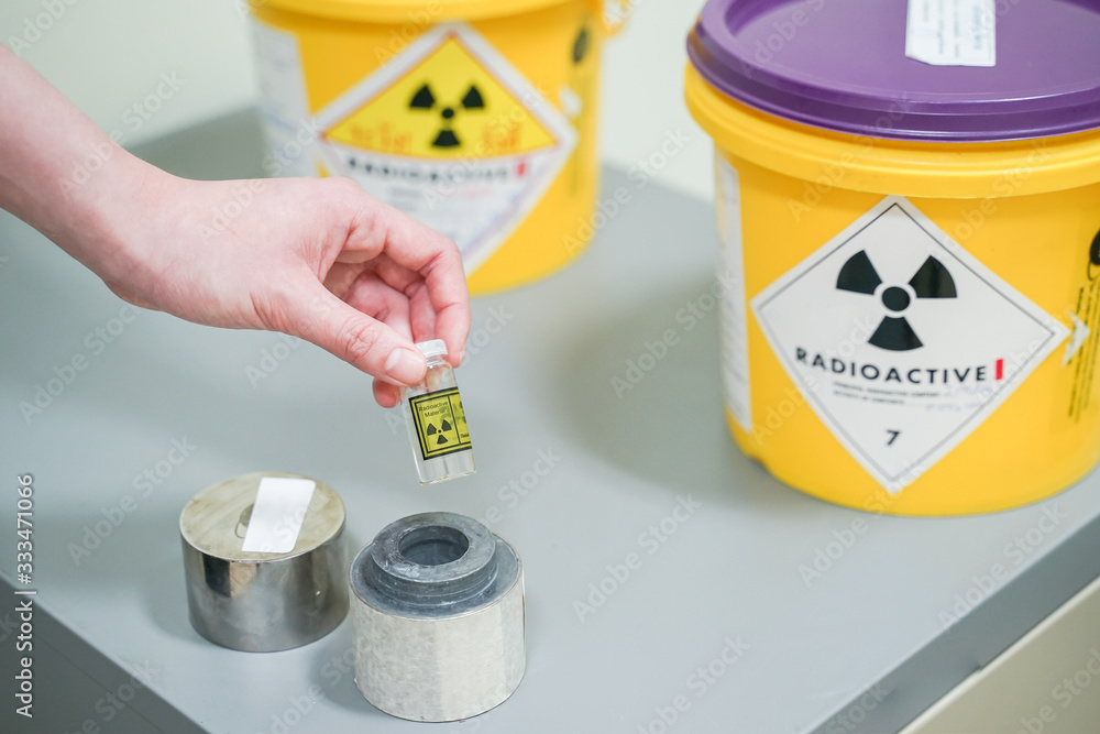 close up hand open lead box of Iodine 131(I-131)Radioactive isotopes ...