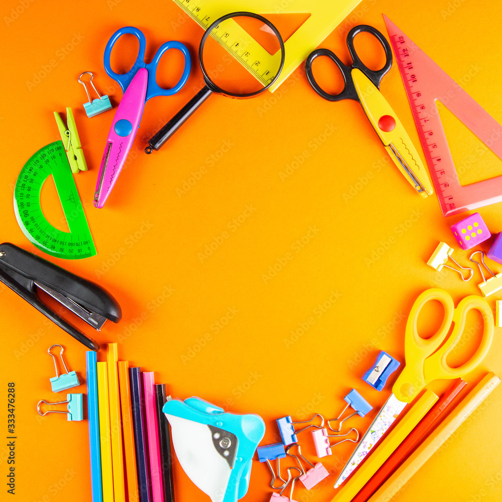 Background texture: school stationery on the orange desk. Stationery ...