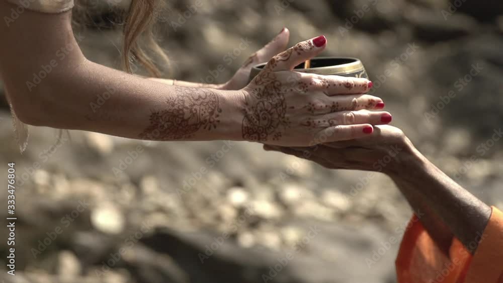 The old monk passes the holy grail, the monk gives the girl a cup of ...