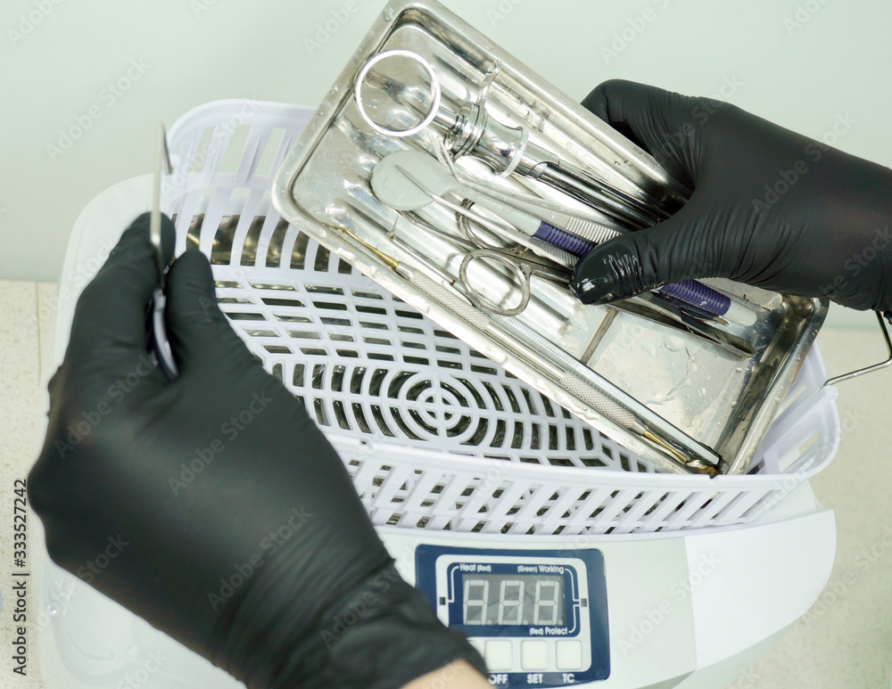 Disinfection of a dental instrument. Ultrasound sterilization of a ...